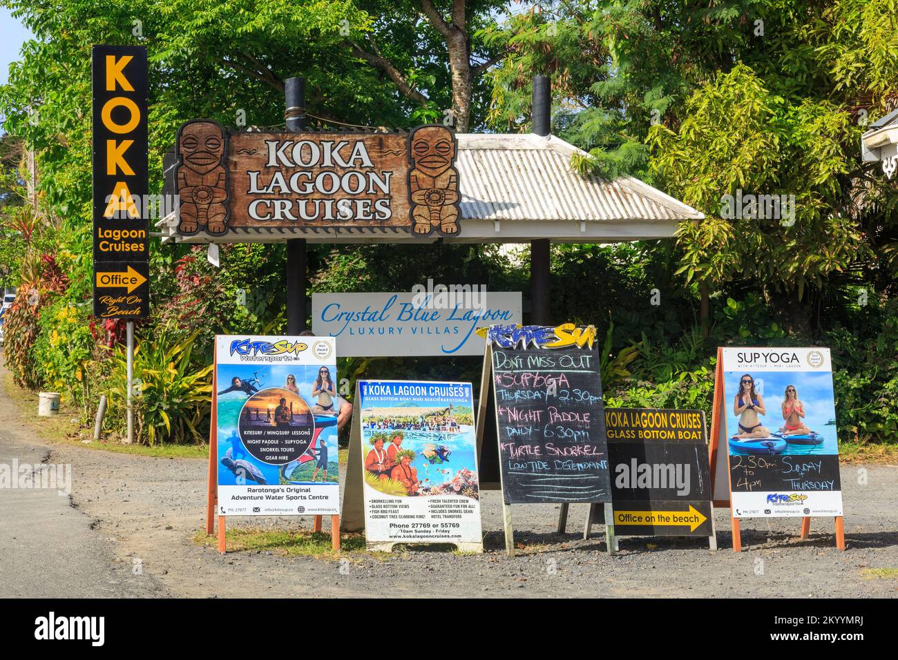 Tour company signs at Muri Beach, a popular holiday destination on the ...