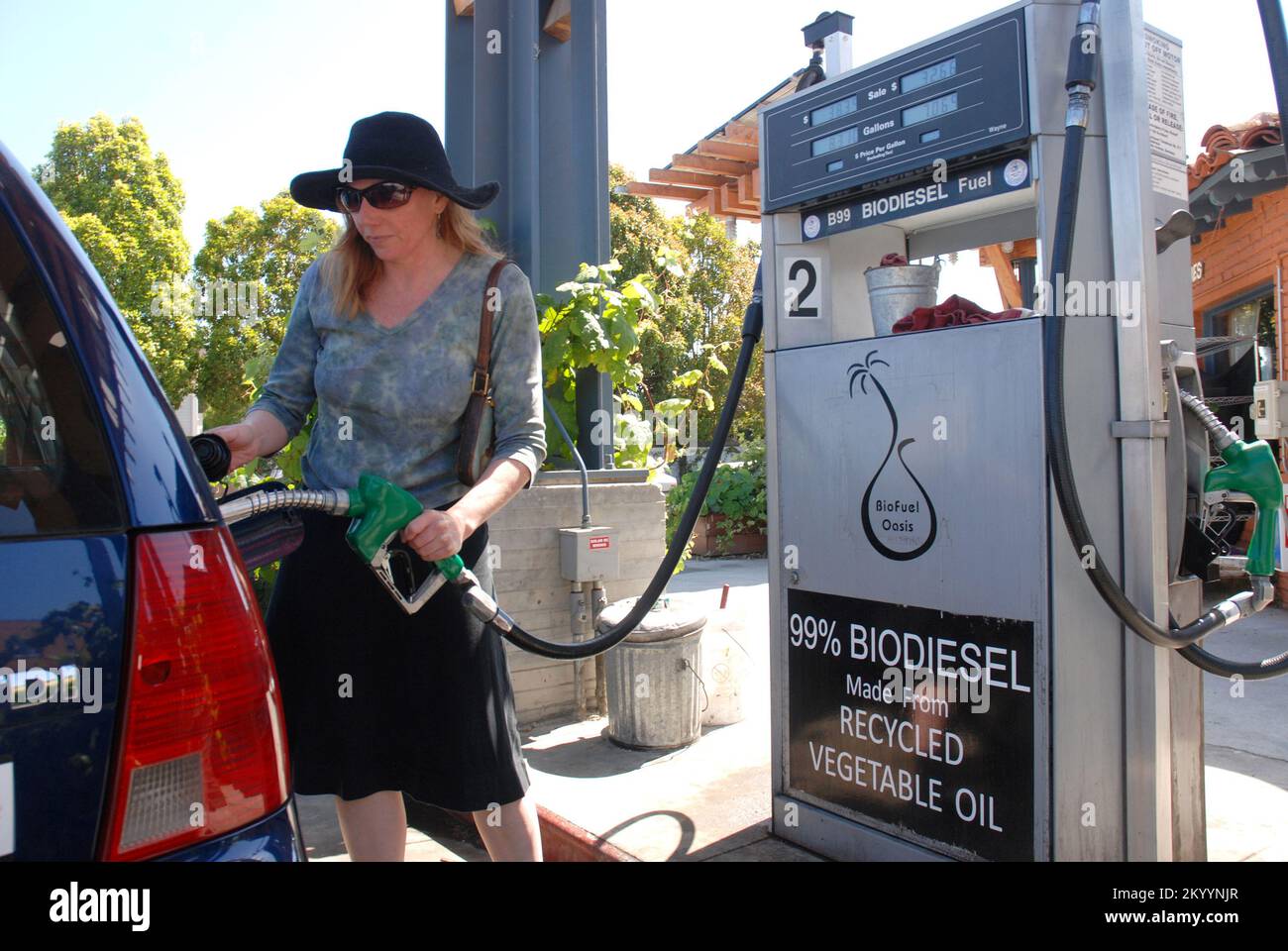 Woman filling tank at Biofuel Oasis, biodiesel station in Berkeley, CA ...