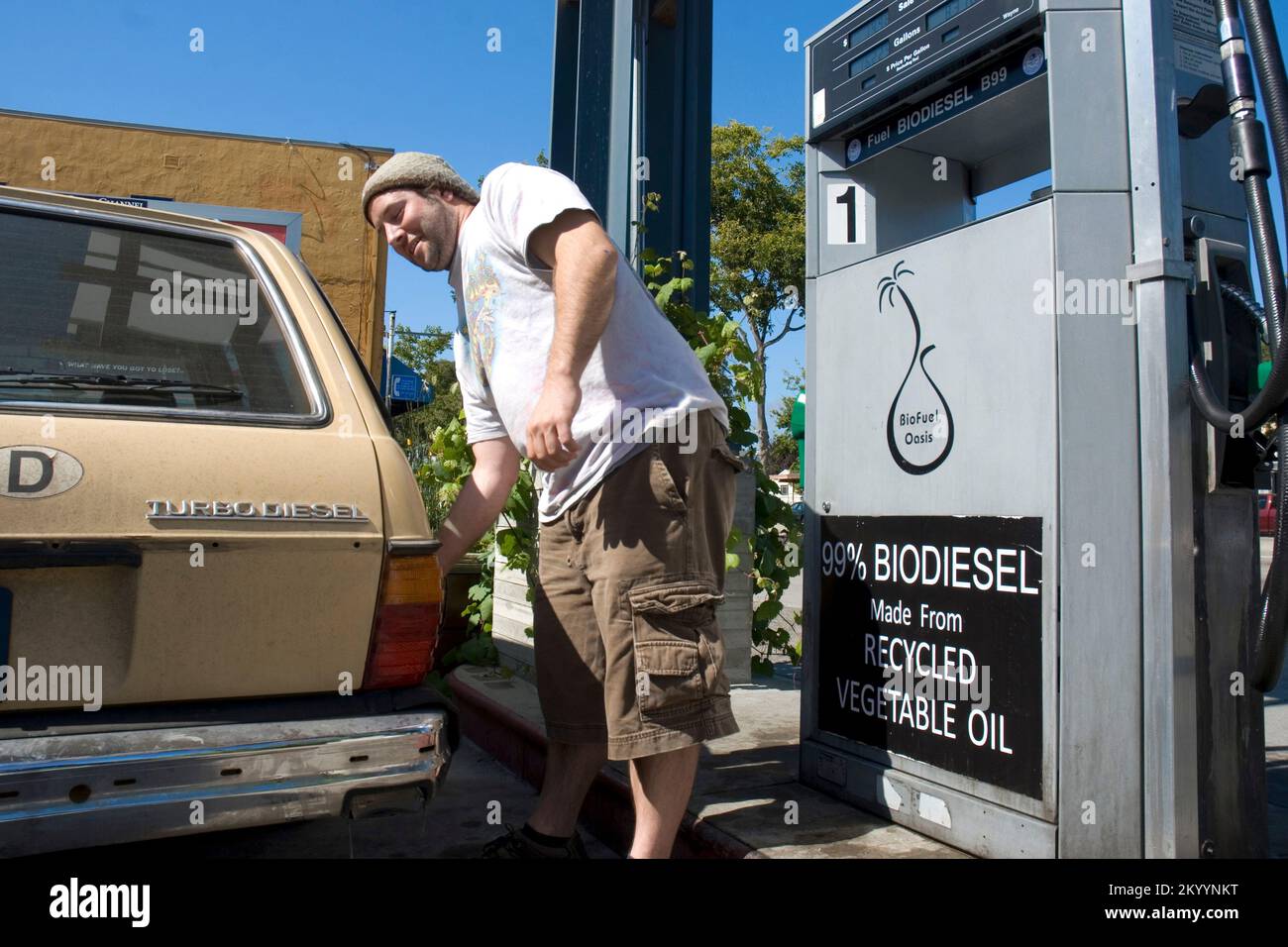 Man filling tank of Mercedes biodiesel car with biodiesel fuel at ...