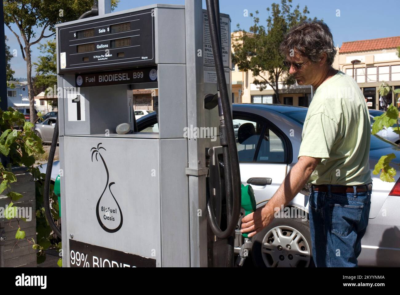 Man filling tank at Biofuel Oasis, biodiesel station in Berkeley, CA ...