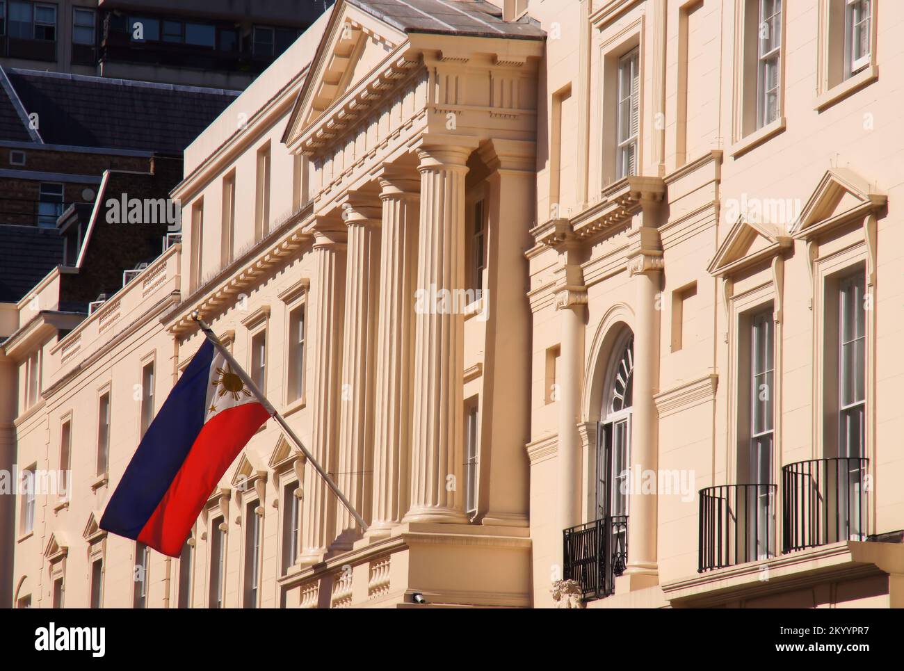 Philippines Embassy flag and building glowing gold soon before sunset ...