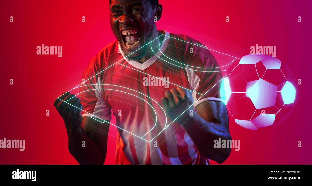 Digital soccer field and ball over cheerful african american male ...