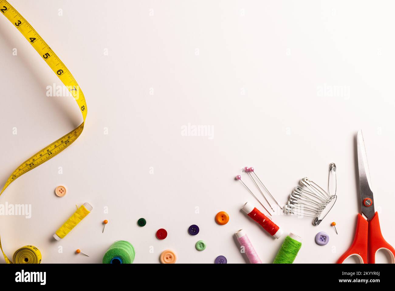 Composition of sewing equipment on white background Stock Photo - Alamy