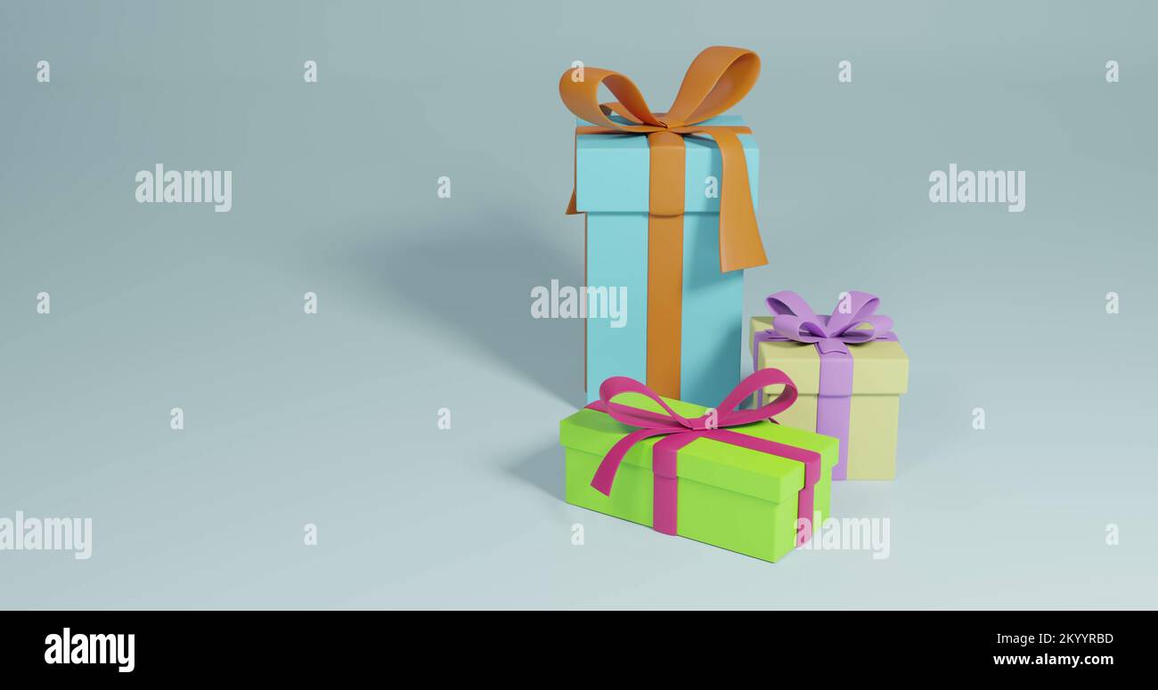 Image of three christmas presents spinning with copy space over grey ...