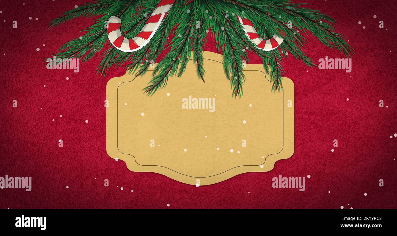 Image of snow falling over candy canes and fir tree over sign with copy ...