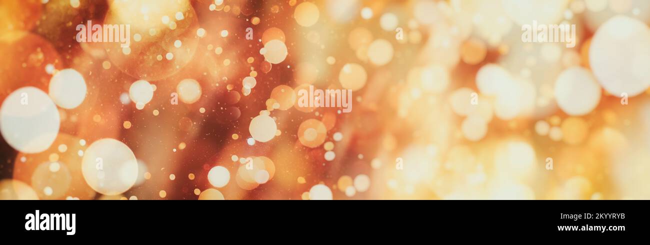 Abstract light celebration background with defocused golden lights for ...