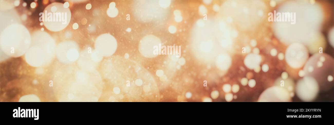 Abstract light celebration background with defocused golden lights for ...