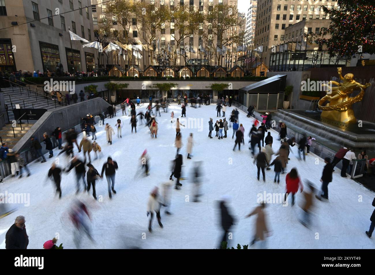 Using a slow shutter speed to create a blurring effect, people are seen ...