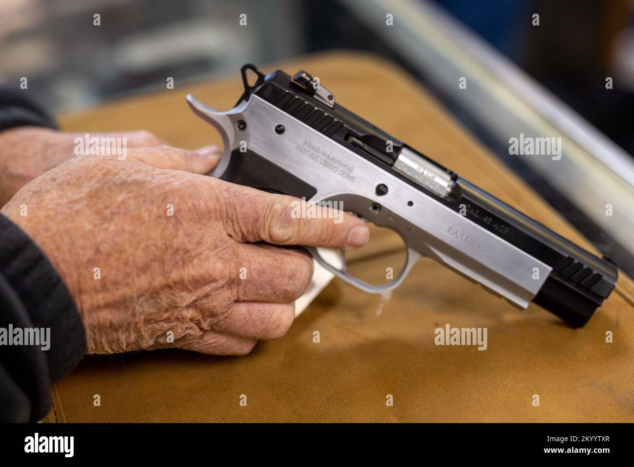 Portland, USA. 02nd Dec, 2022. An employee of The Gun Room, a Portland ...