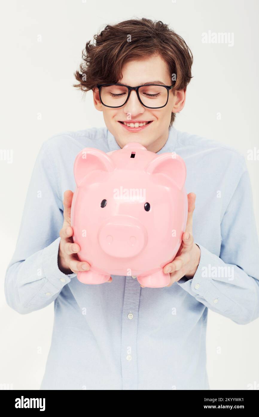 My rainy-day money is piling up. A handsome young man looking through ...