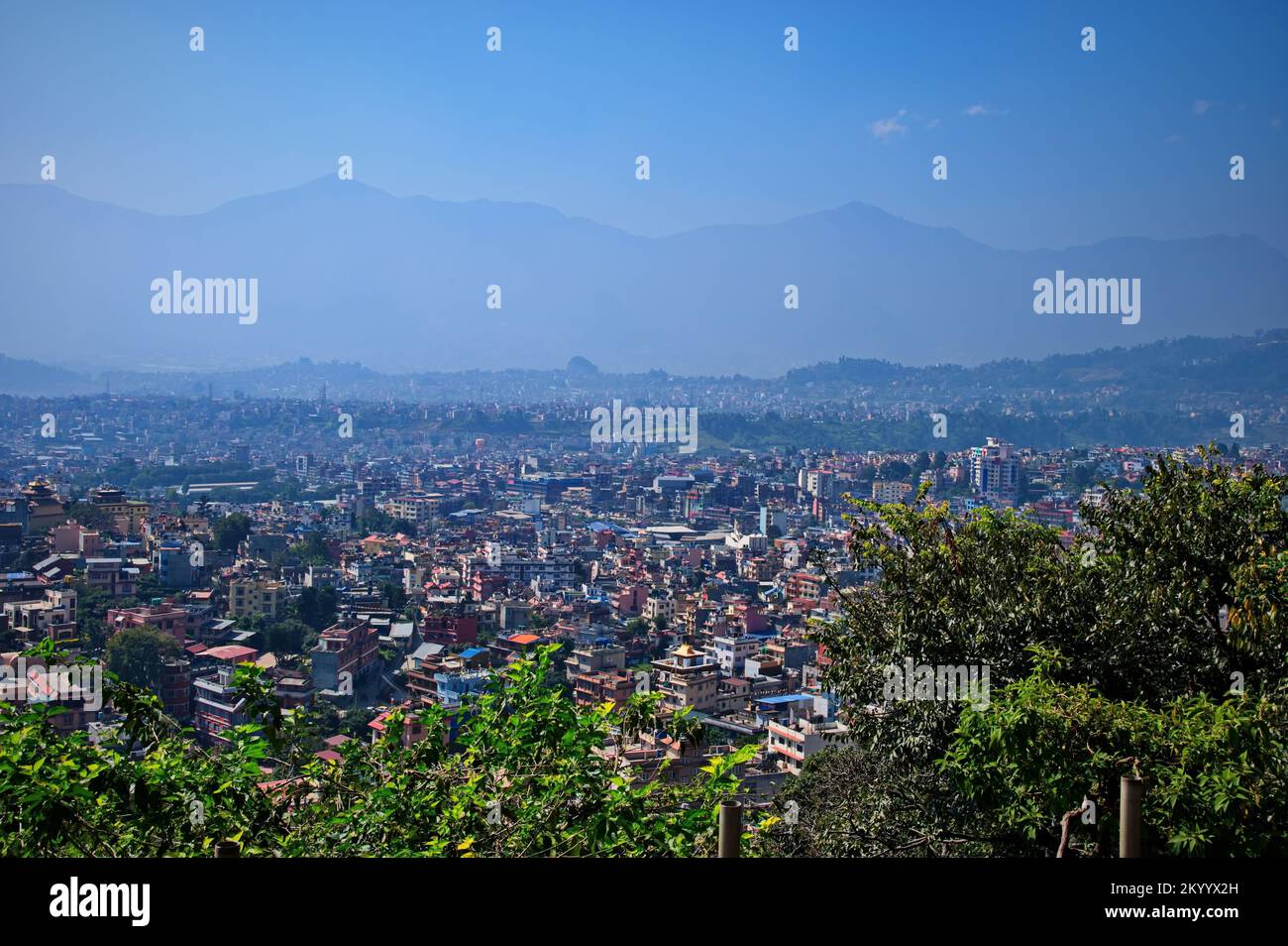 Panoramic view of the Kathmandu in Nepal through the tree branches ...
