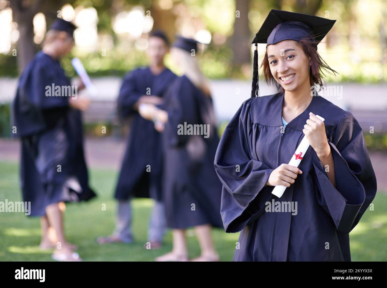 Feeling accomplished. Portrait of a smiling graduate holding her ...