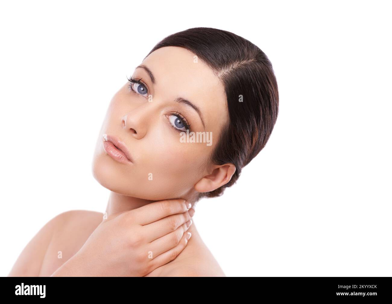 Silky smooth skin. A beautiful young woman looking at the camera while ...