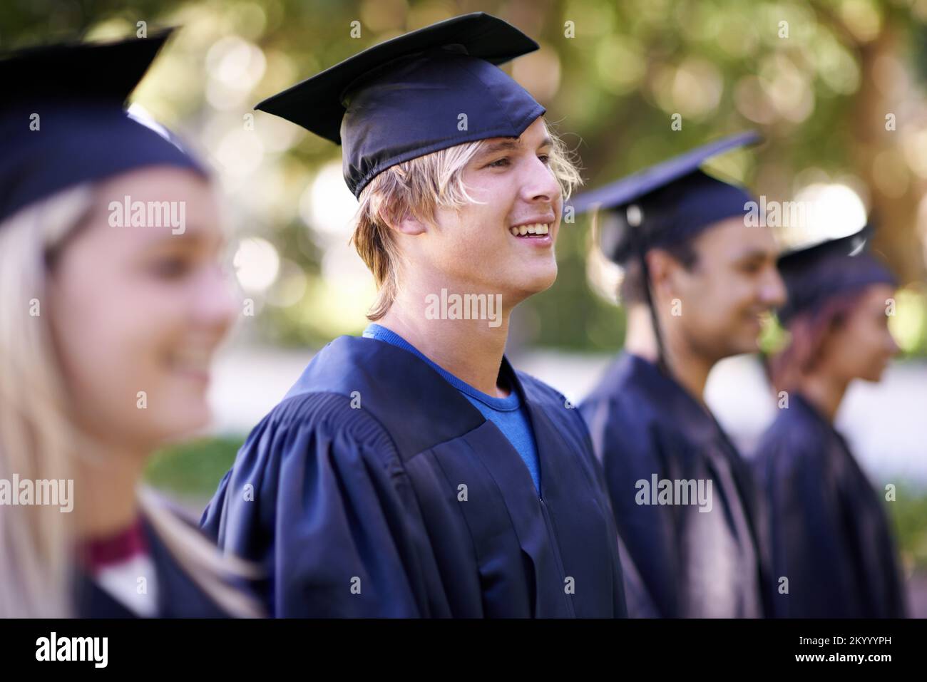Proud of our achievements. A group of graduates standing in a row ...