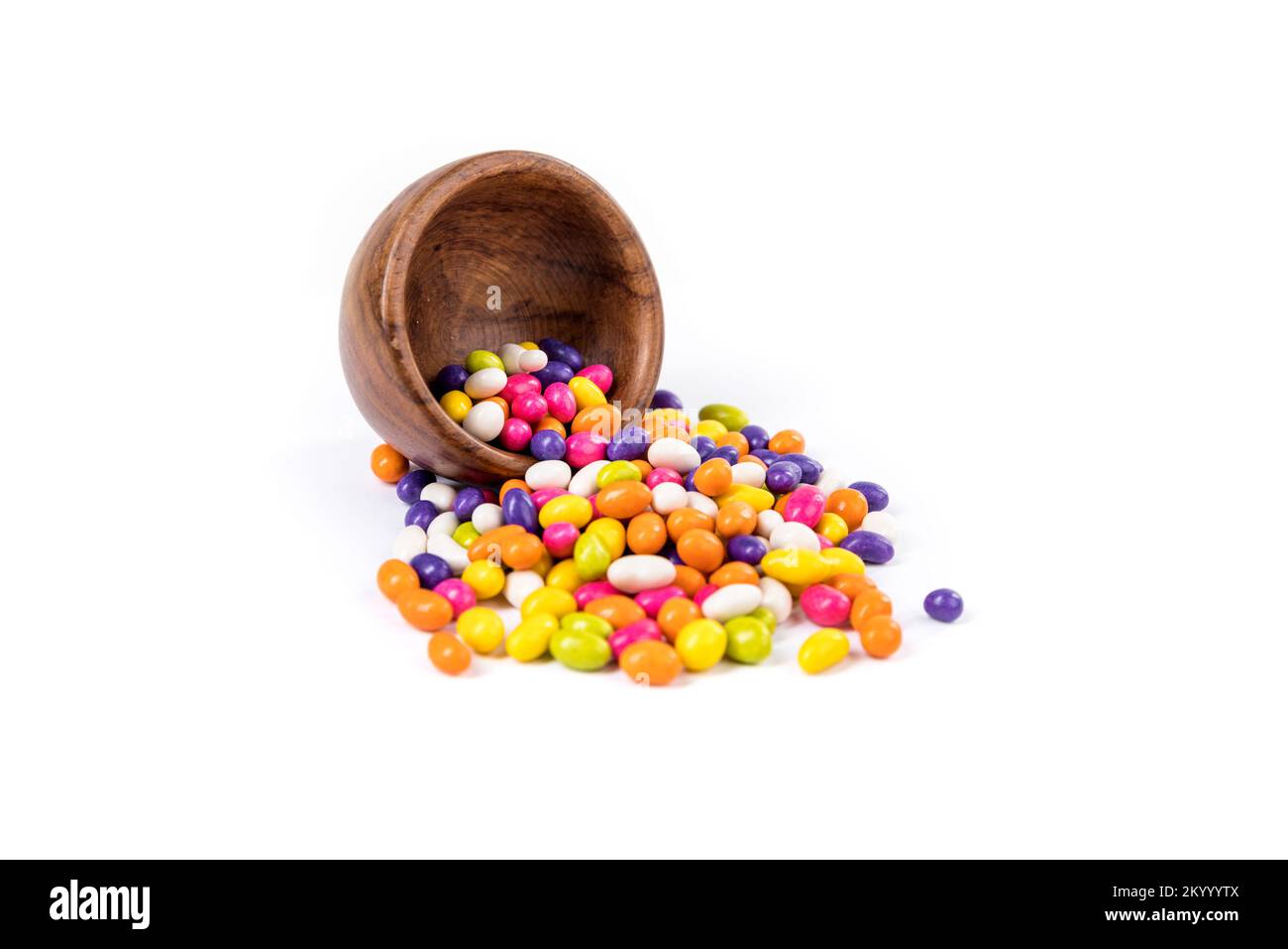 Fennel seed candy spilling from a bowl over white Stock Photo - Alamy