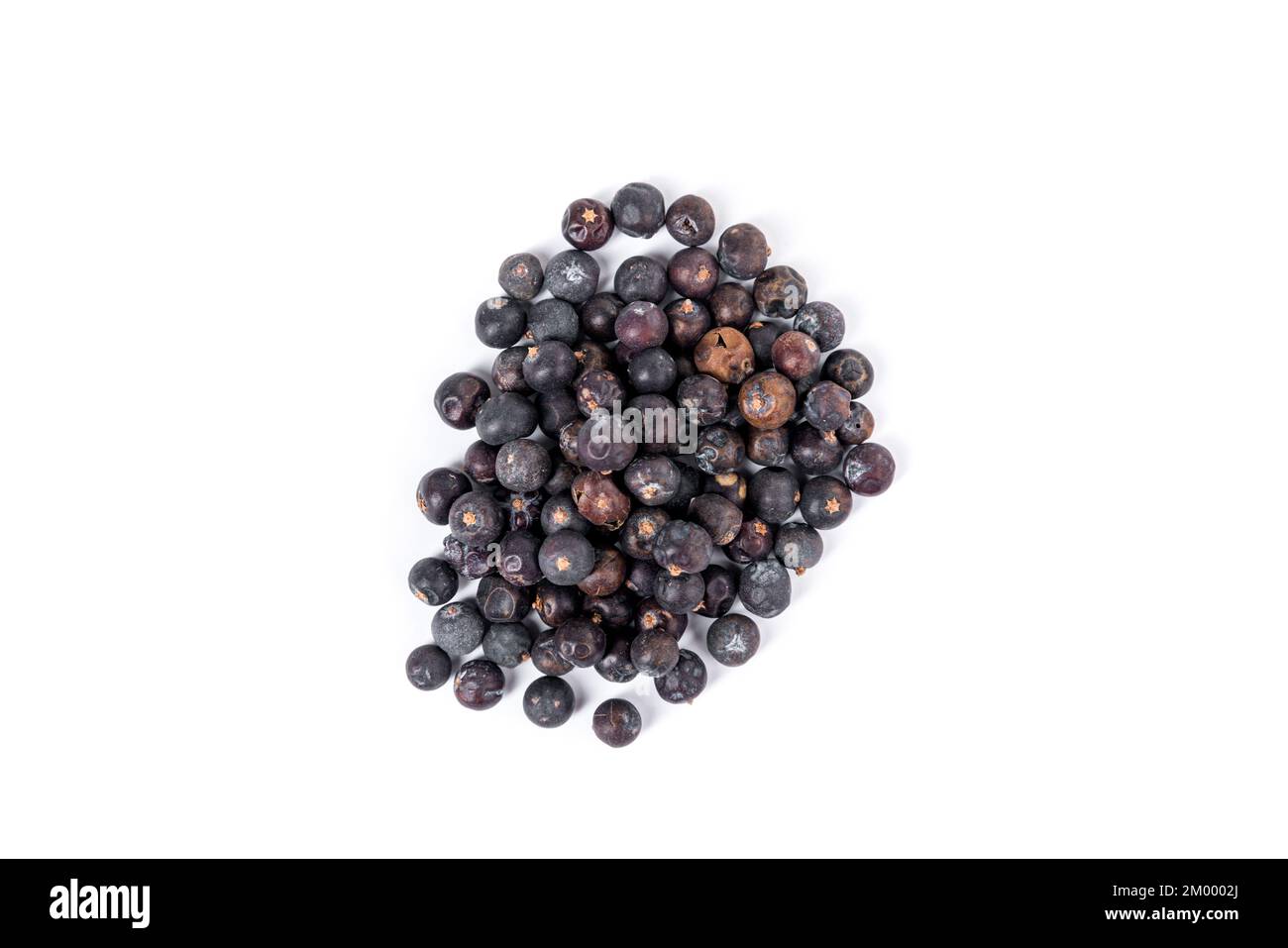 Juniper berries in a pile isolated over white top down Stock Photo - Alamy