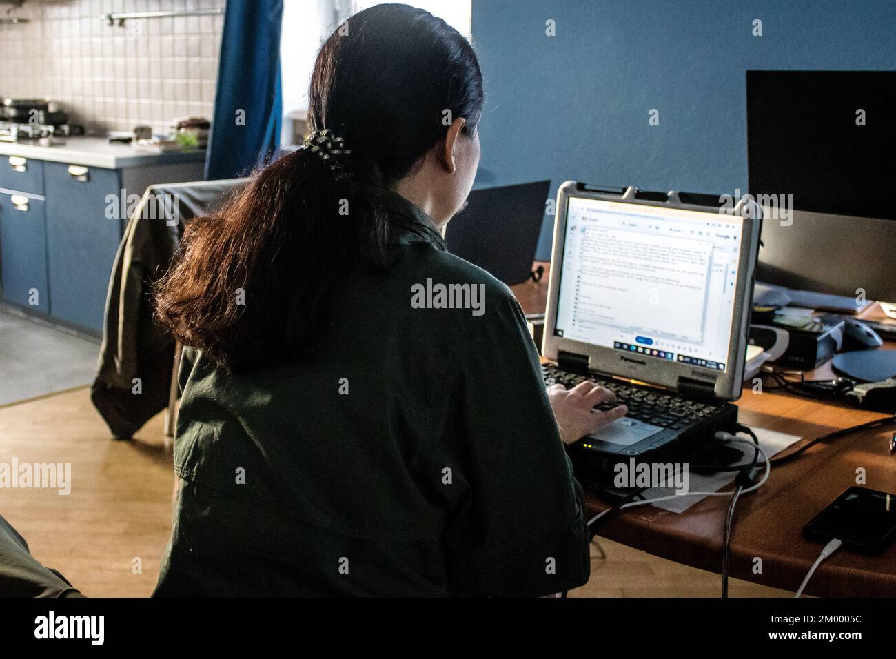 Female volunteer working in Kyiv at the office of Sons of Liberty ...
