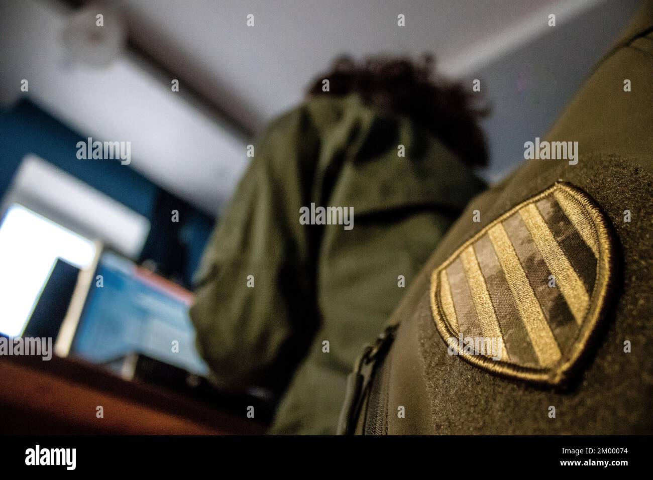 Female volunteer working in Kyiv at the office of Sons of Liberty ...