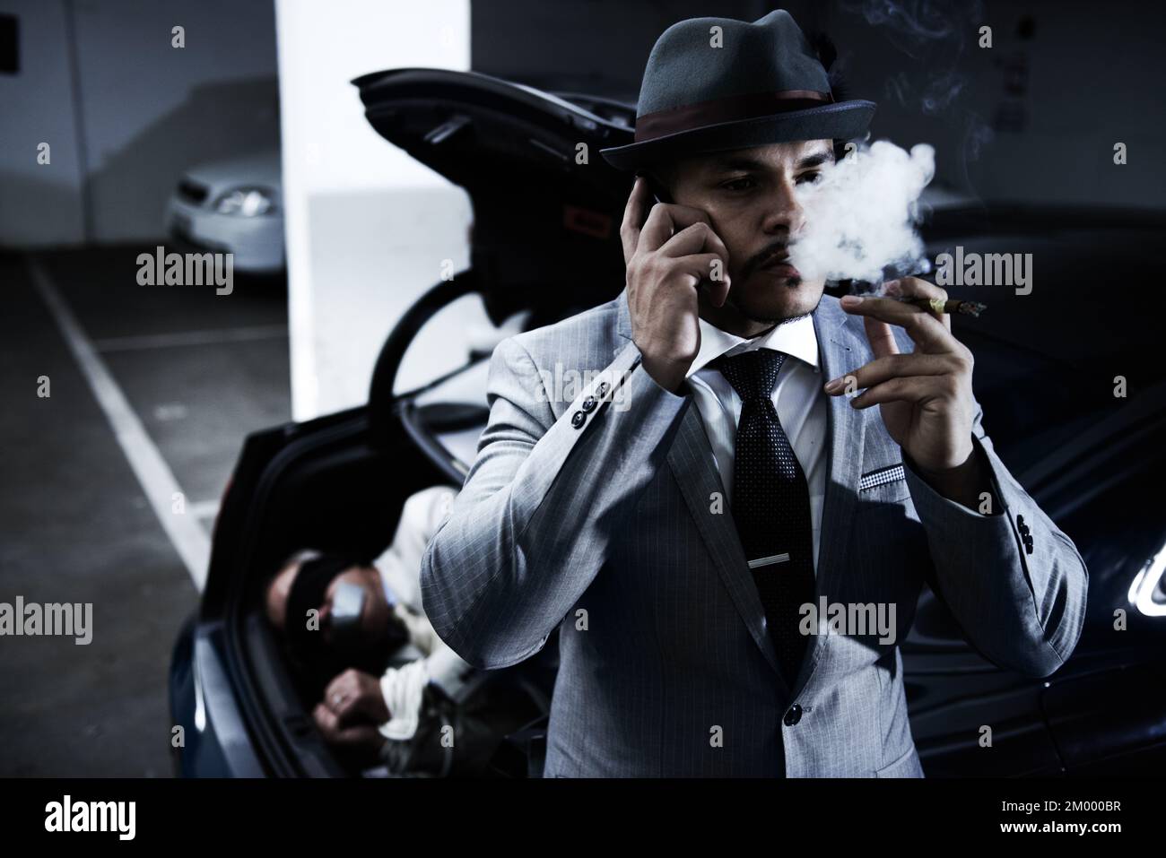 Violent crime doesnt perturb him. An arrogant mobster blowing smoke ...
