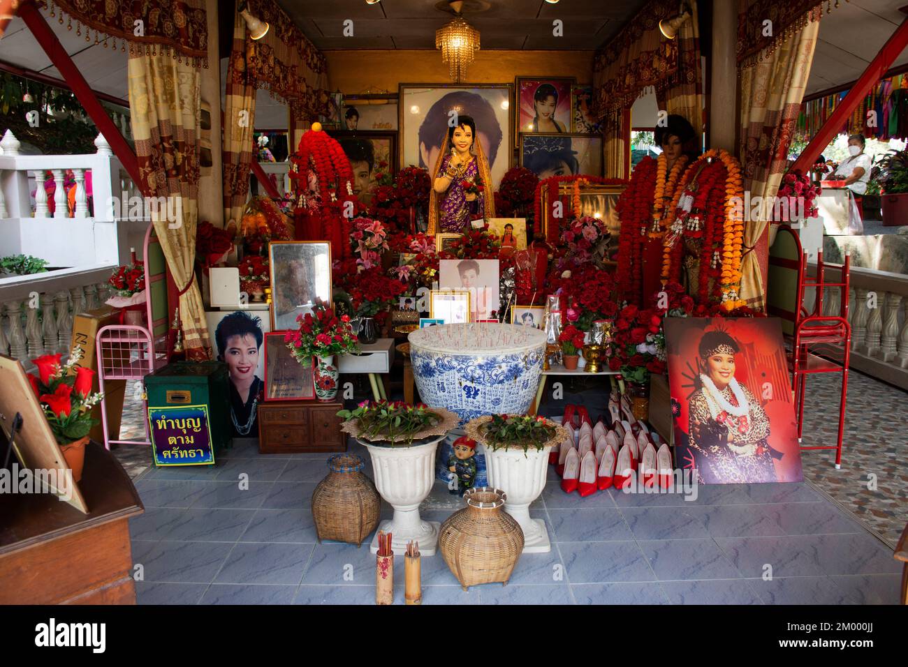 Ancient small shrine and antique angel deity statue for thai people ...