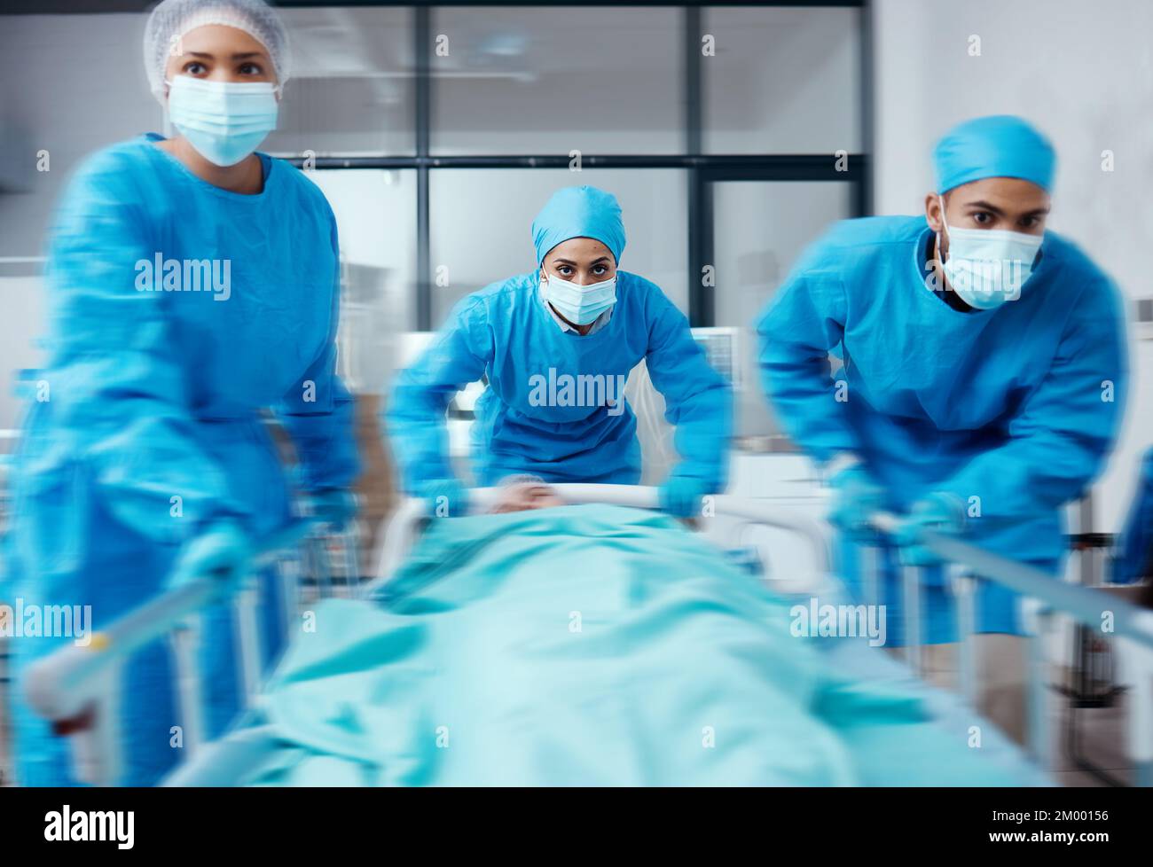 Surgery team, bed and rush in hospital, healthcare or patient emergency ...