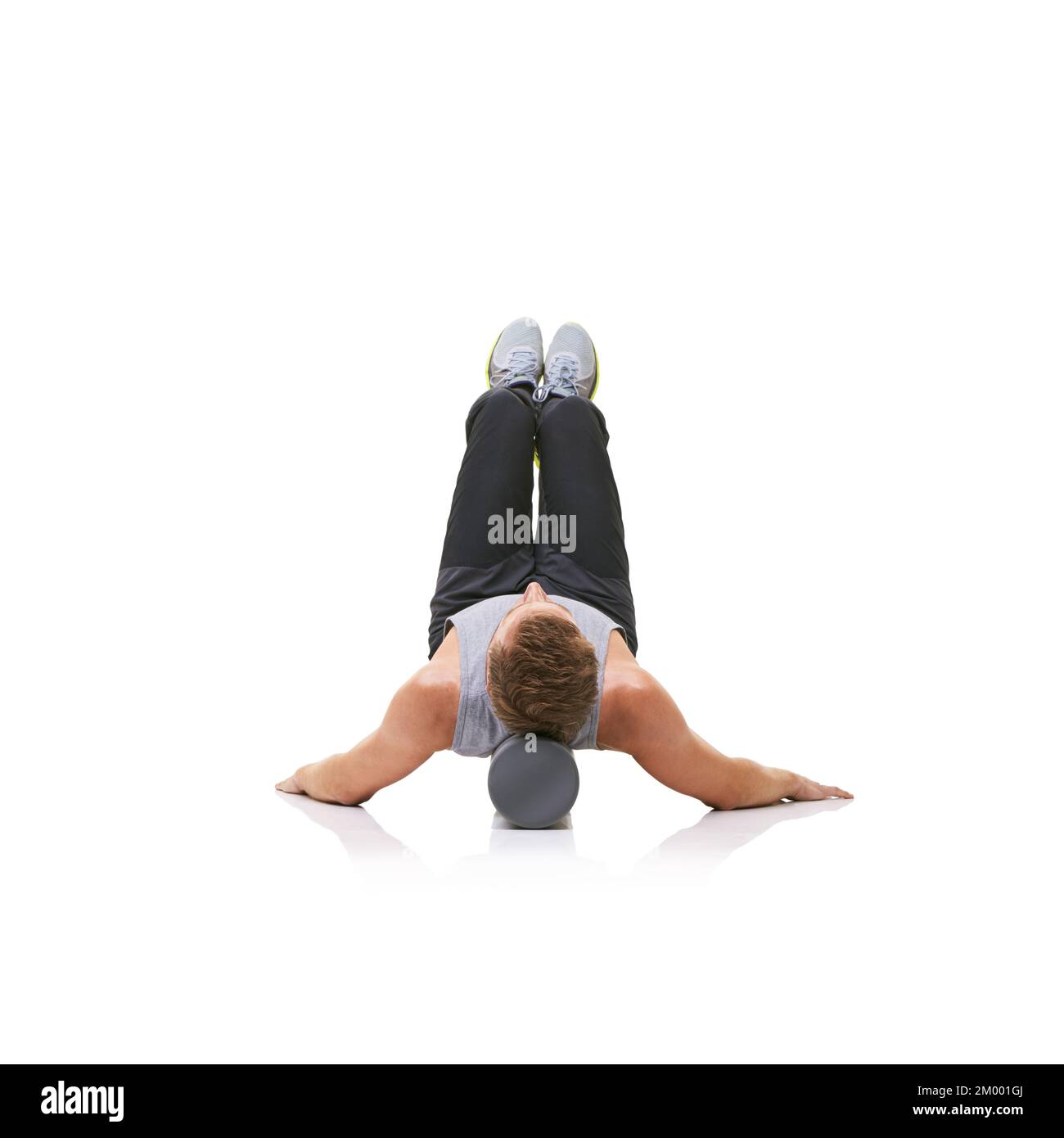 Holding the pose takes strength and stamina. A young man lying on a ...