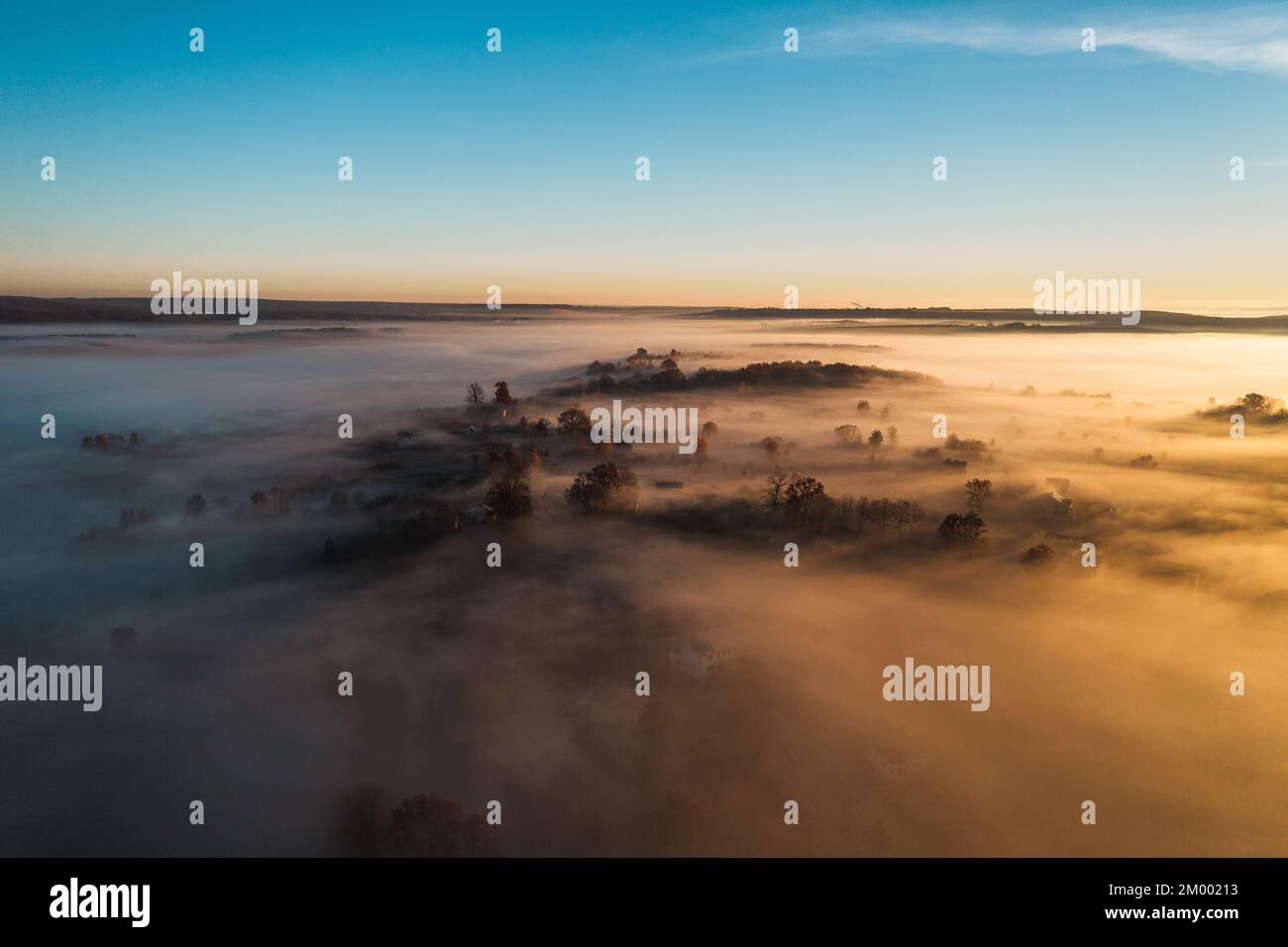 Morning fog, Ukrainian village covered with fog, drone view, aerial photography, sunrise in a ...