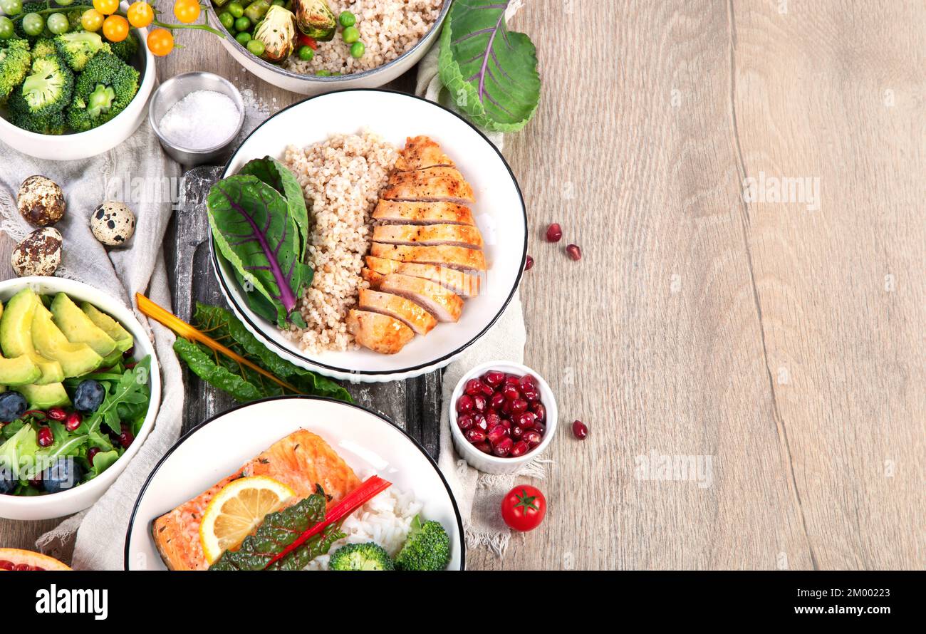 Table of various healthy food dishes. Healthy food assortment. Dieting ...