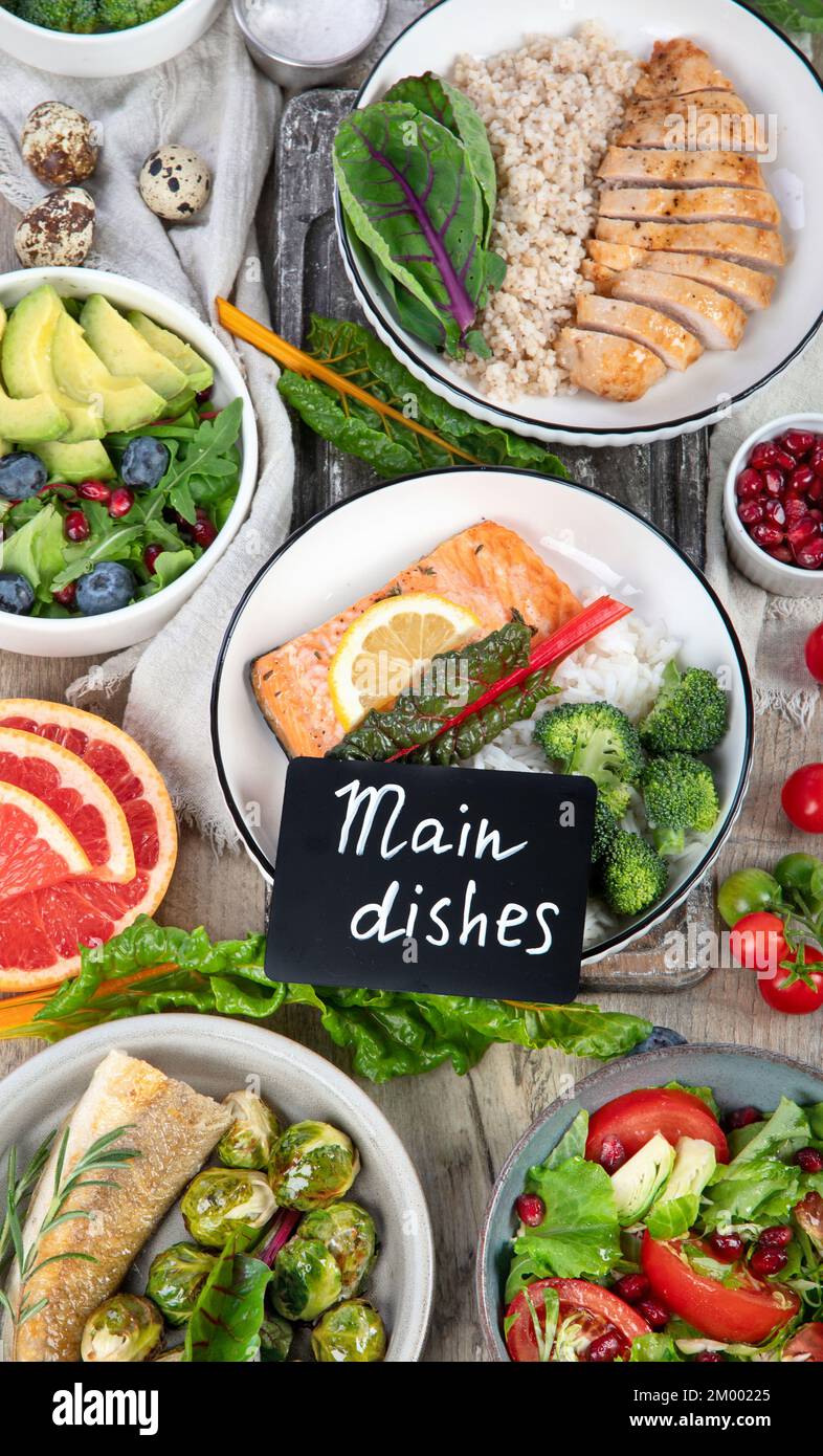 Table of various healthy food dishes. Healthy food assortment. Dieting ...