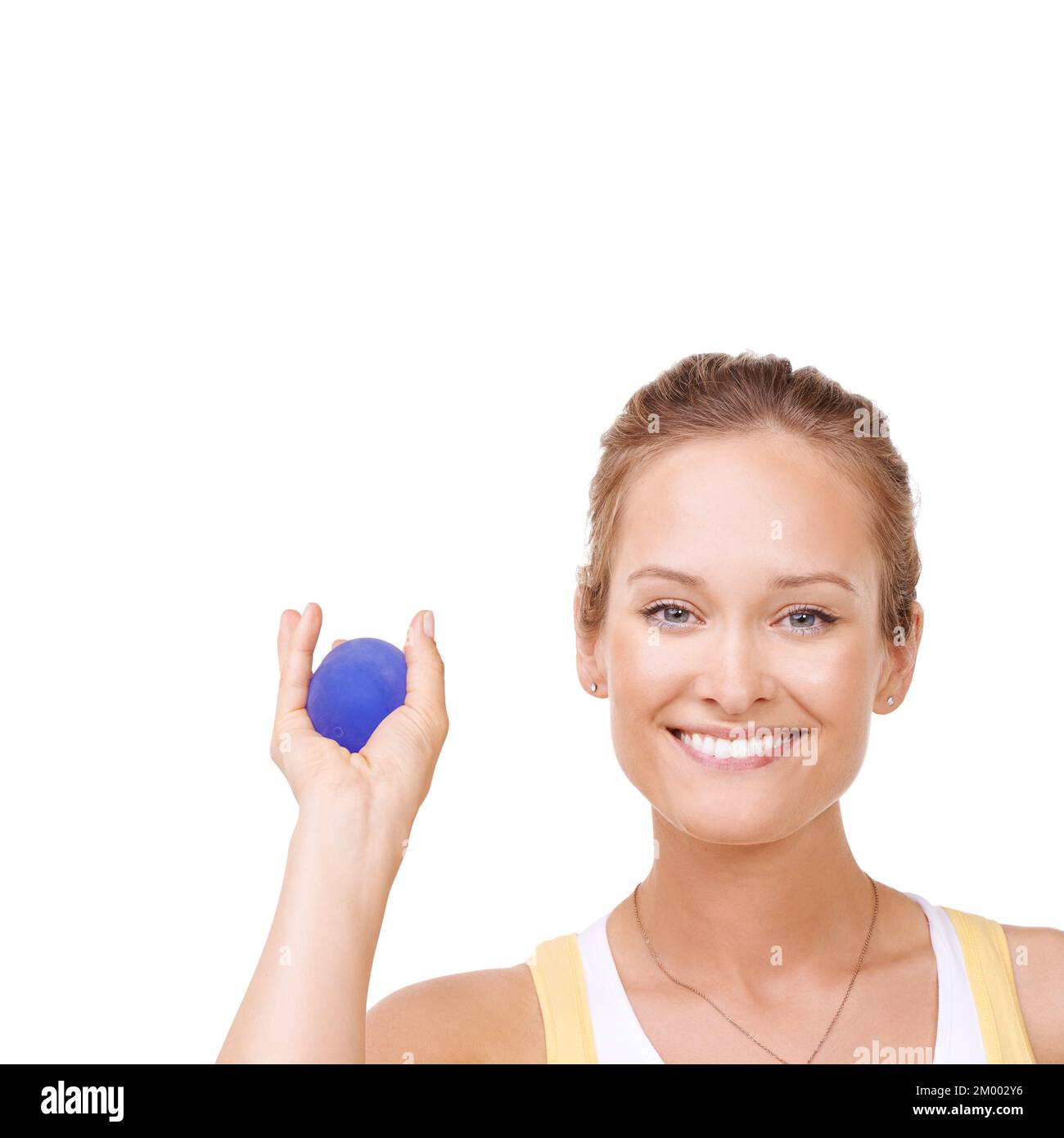 Strengthening her hands and arms. Cropped view of a woman squeezing a ...