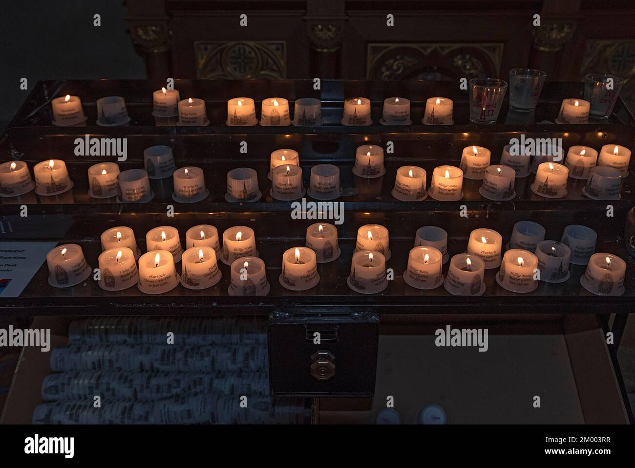 Offering candles in the parish church of Maria Opferung, Riezlern ...