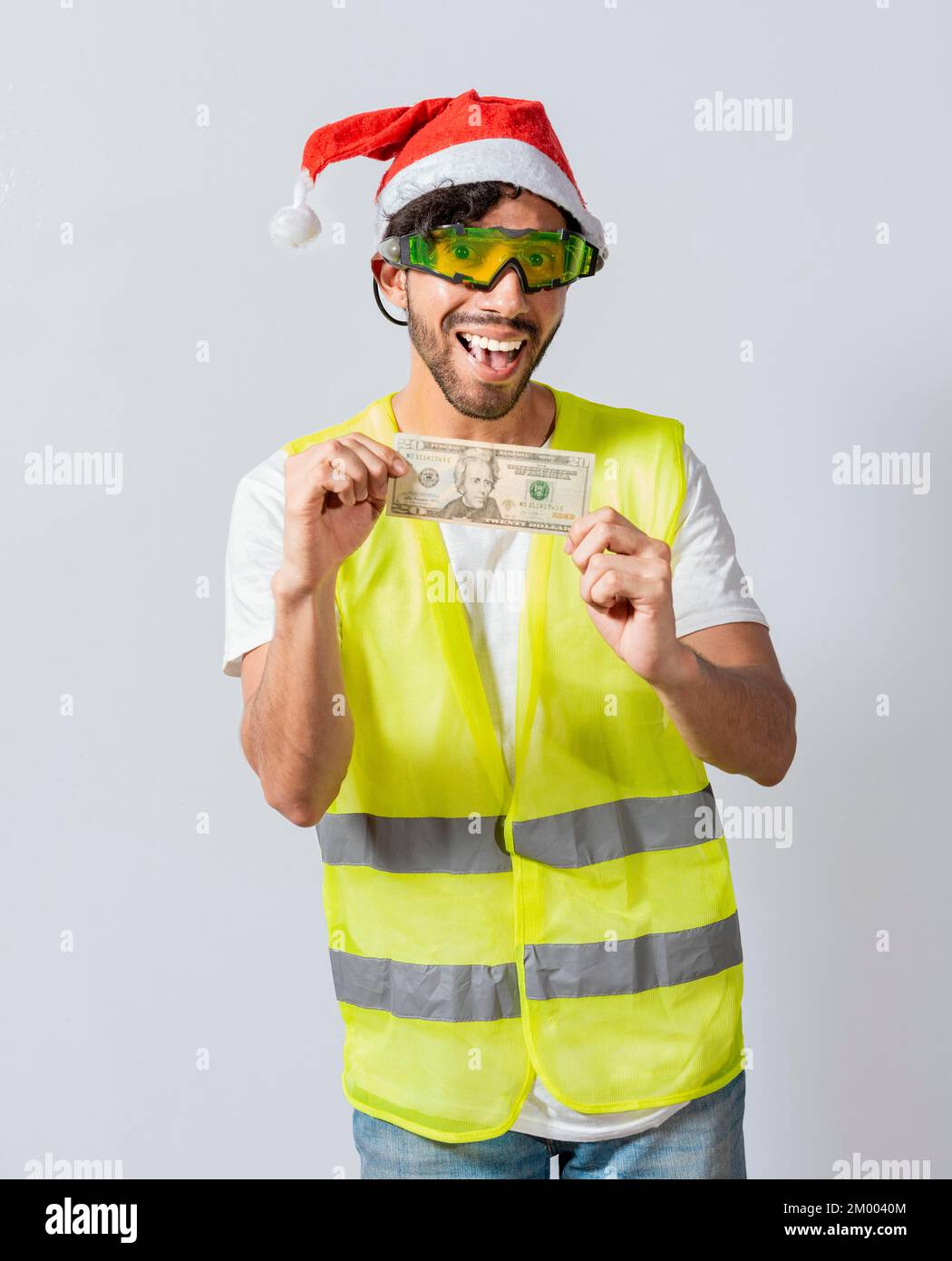 Happy builder engineer with christmas hat holding one dollar bill ...