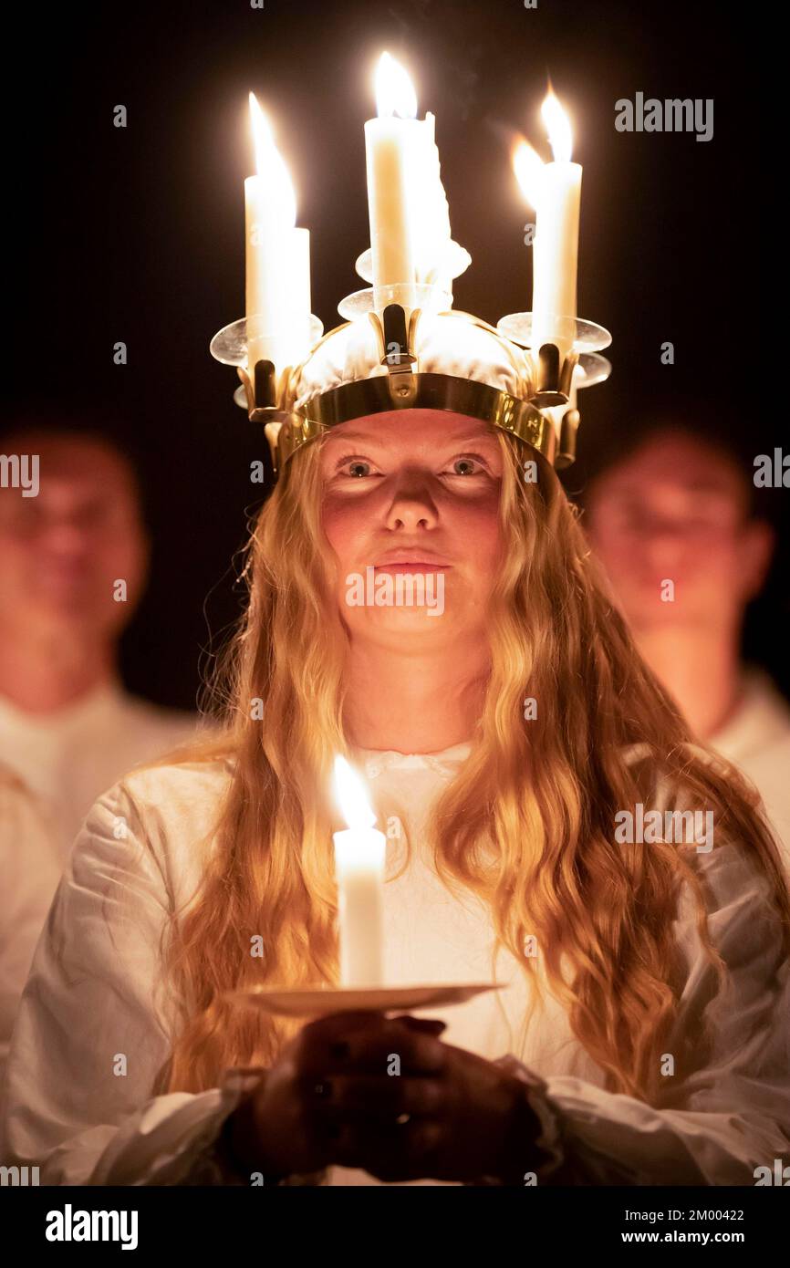 Clara Nordin wears a crown of candles symbolising St Lucy as she leads ...
