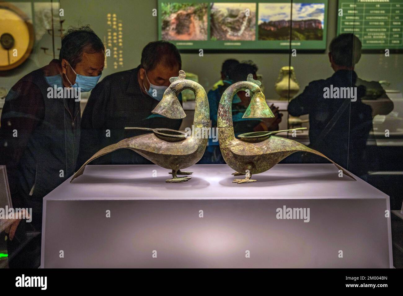 NANNING, CHINA - DECEMBER 1, 2022 - People view feathered bronze ...