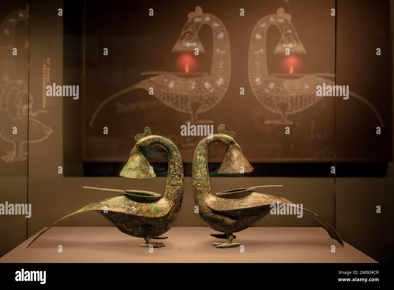 NANNING, CHINA - DECEMBER 1, 2022 - A feathered bronze phoenix lamp ...