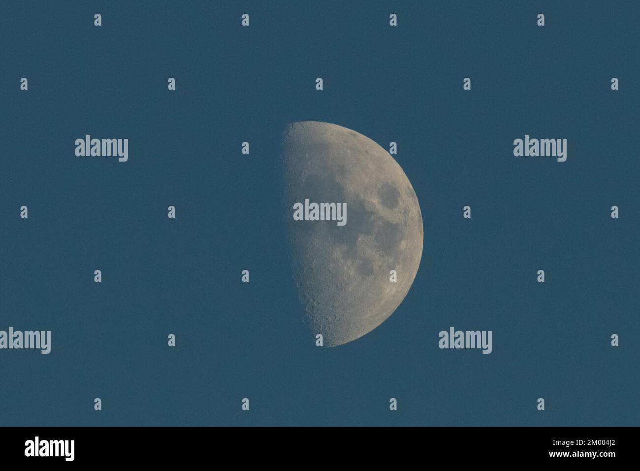 Crescent moon in front of blue universe Stock Photo - Alamy