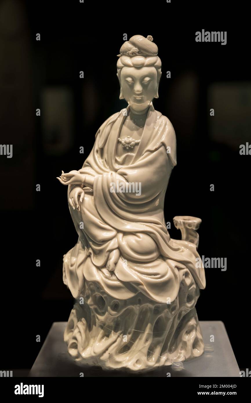 NANNING, CHINA - DECEMBER 1, 2022 - A white-glazed Guanyin sitting ...