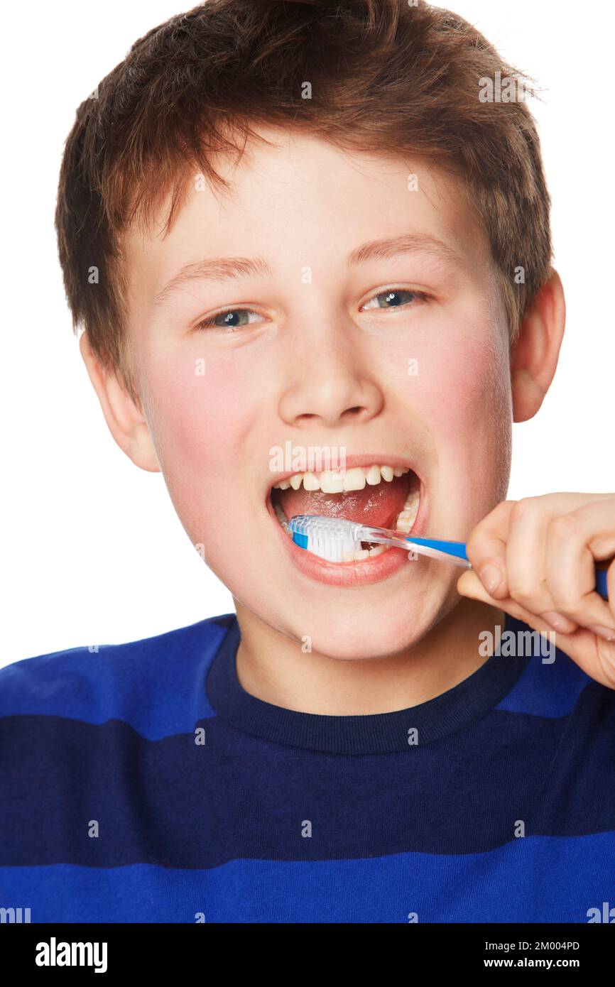 Preventing cavities. Portrait of a young boy brushing his teeth Stock ...