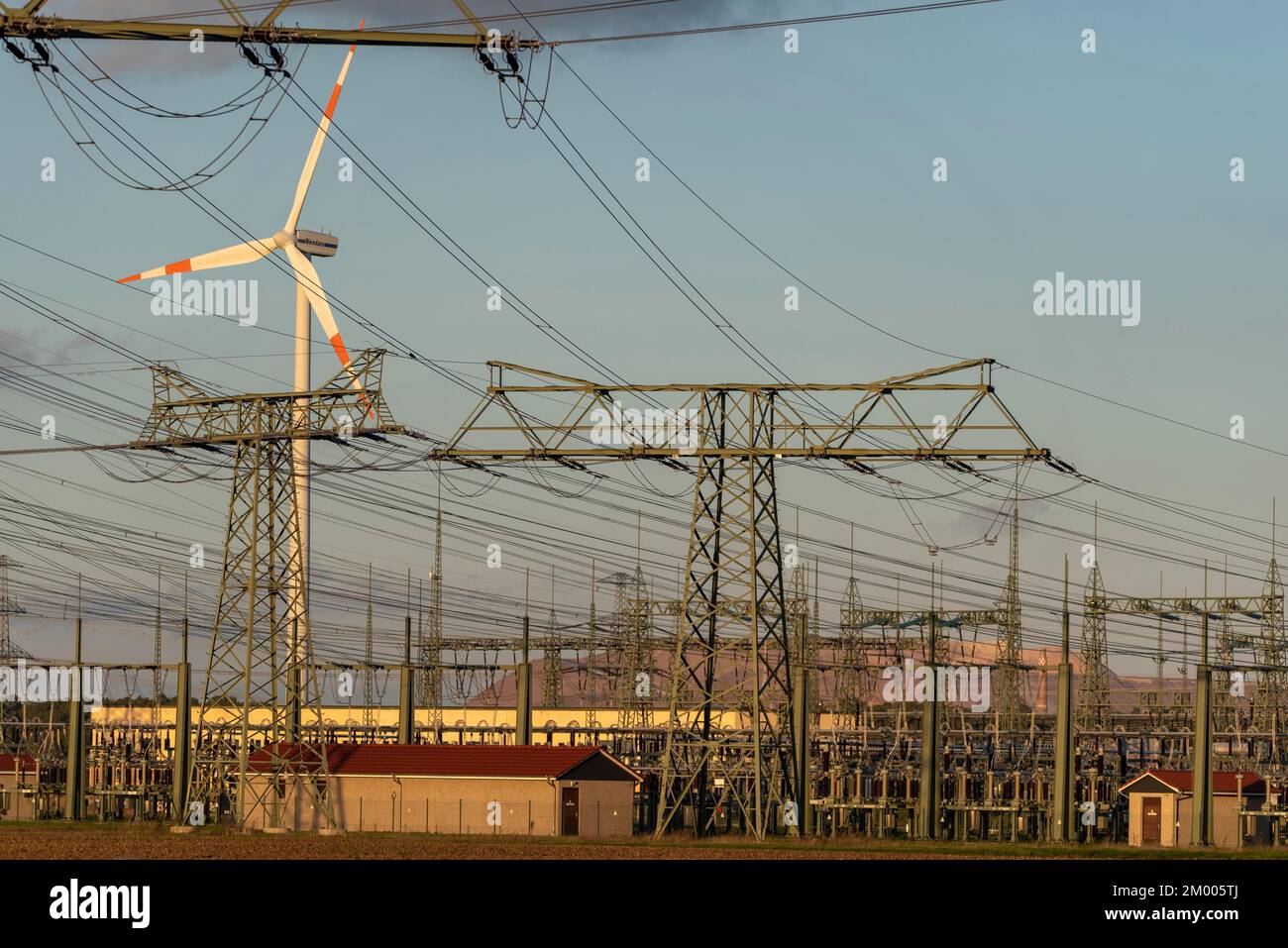 Power pylons, wind turbine, high-voltage lines, Wolmirstedt substation ...