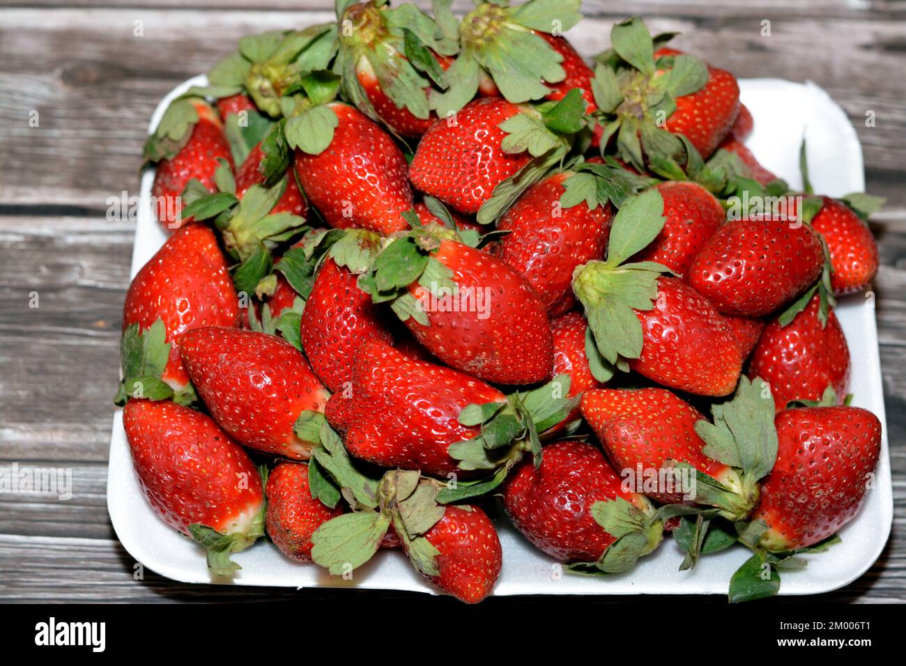 Pile of fresh strawberries fruit, the garden strawberry is a widely ...