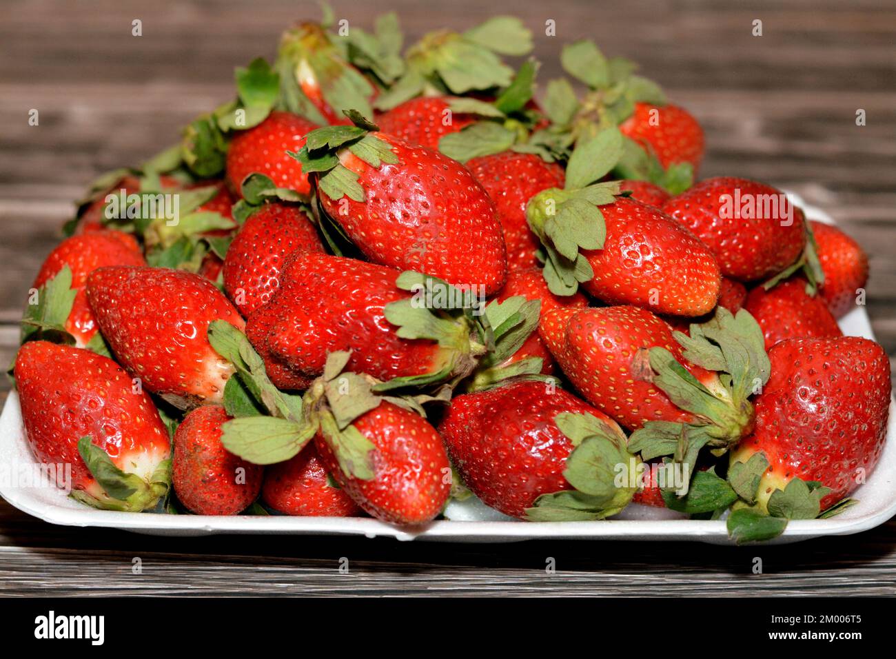 Pile of fresh strawberries fruit, the garden strawberry is a widely ...