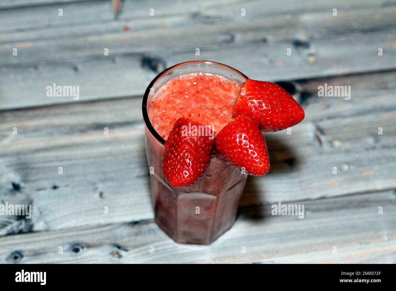 Fresh Strawberry fruit juice, the garden strawberry is a widely grown ...