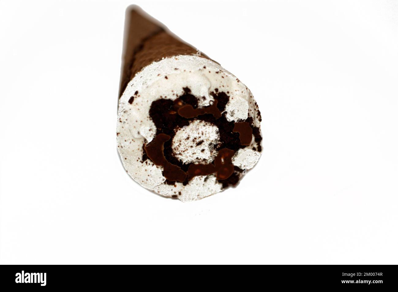 Ice cream vanilla cone with topping of chocolate chips pieces in a ...