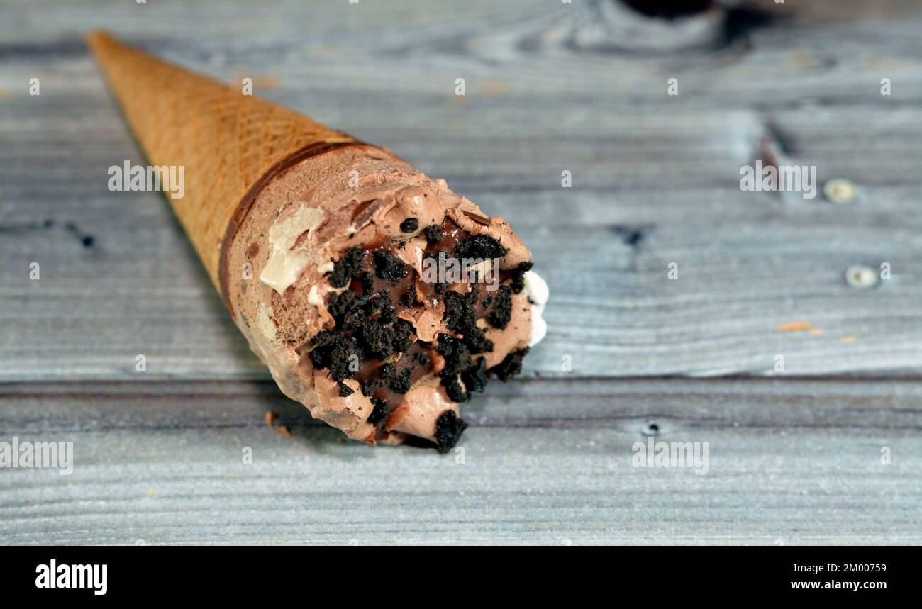 Ice cream of creamy cocoa chocolate cone with topping of chocolate ...