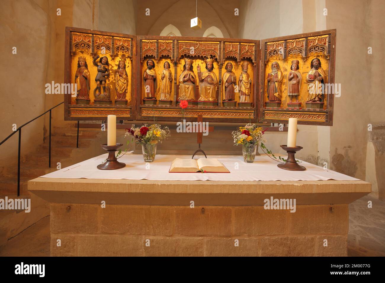 Interior view and folding altar with candles, bible and bouquet of ...