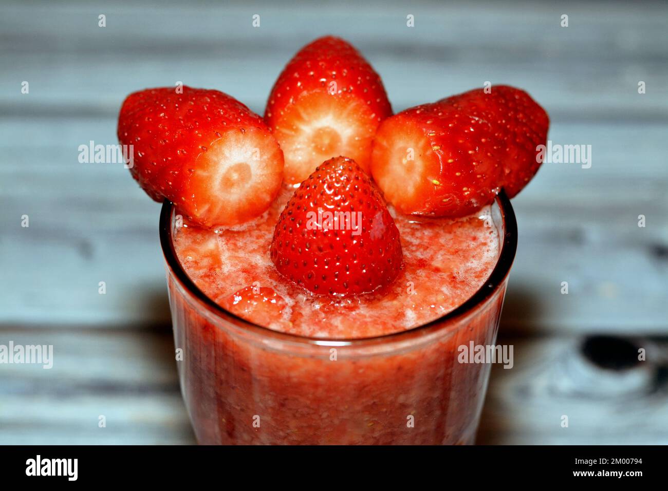 Fresh Strawberry fruit juice, the garden strawberry is a widely grown ...