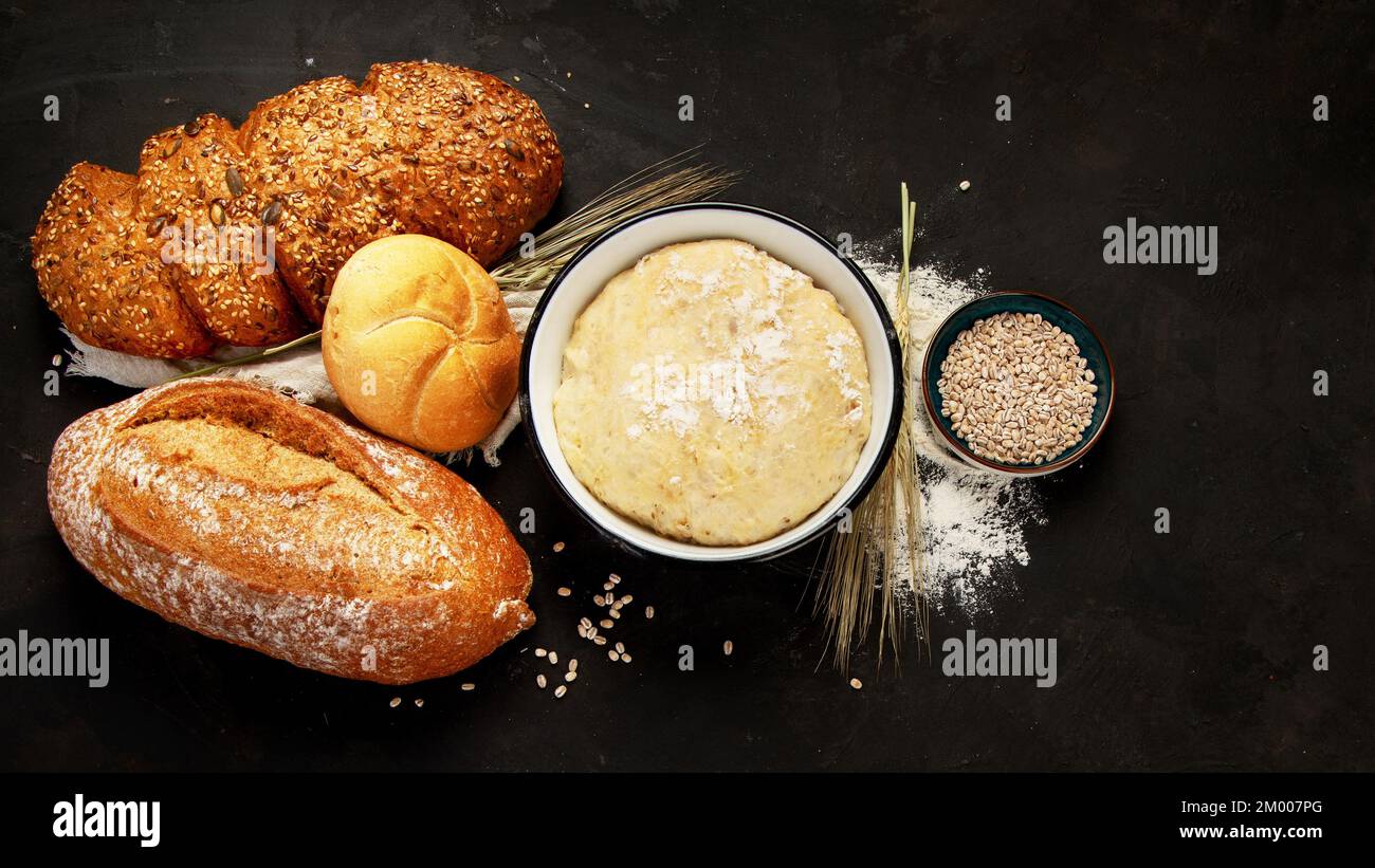 Bread assortment on dark background. Fresh homemade pastry. Top view ...
