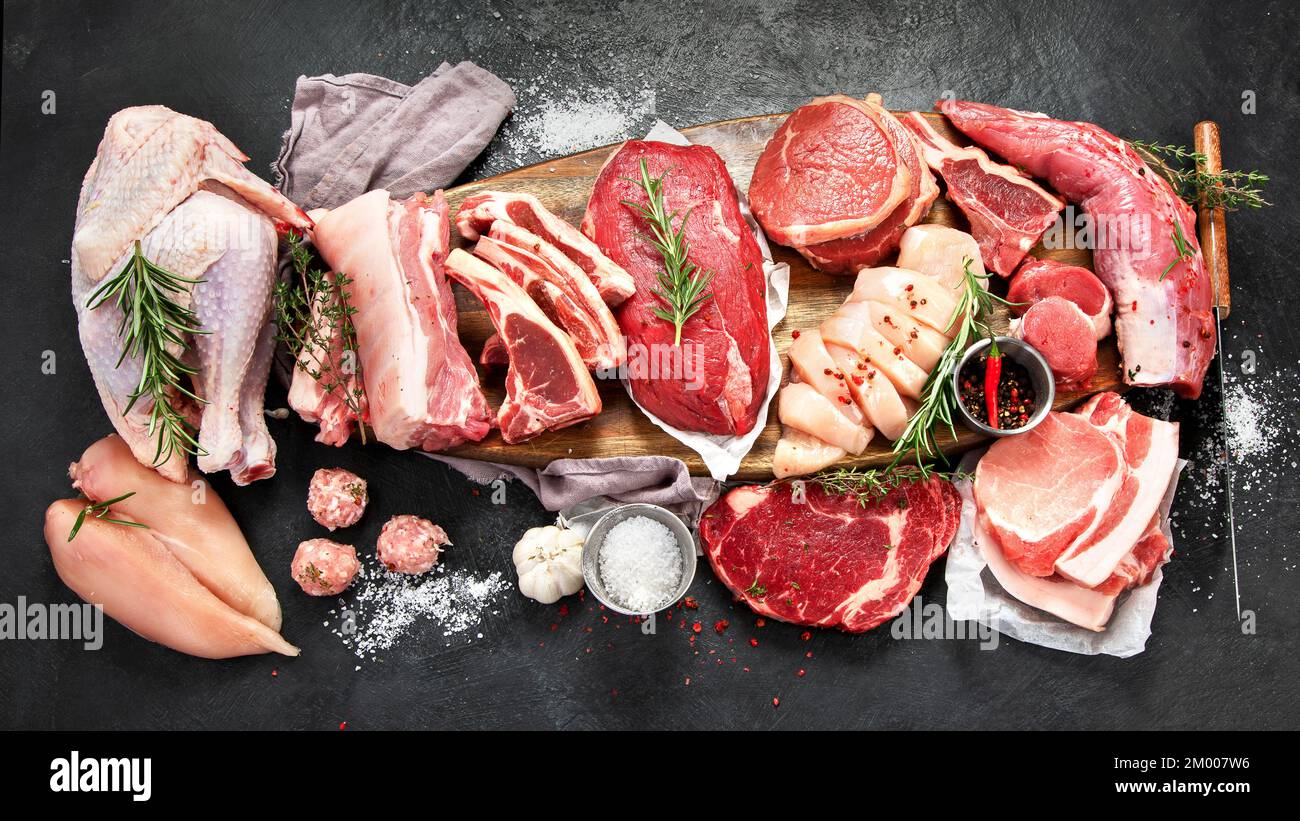 Different types of raw meat - beef, pork, lamb, chicken on dark ...