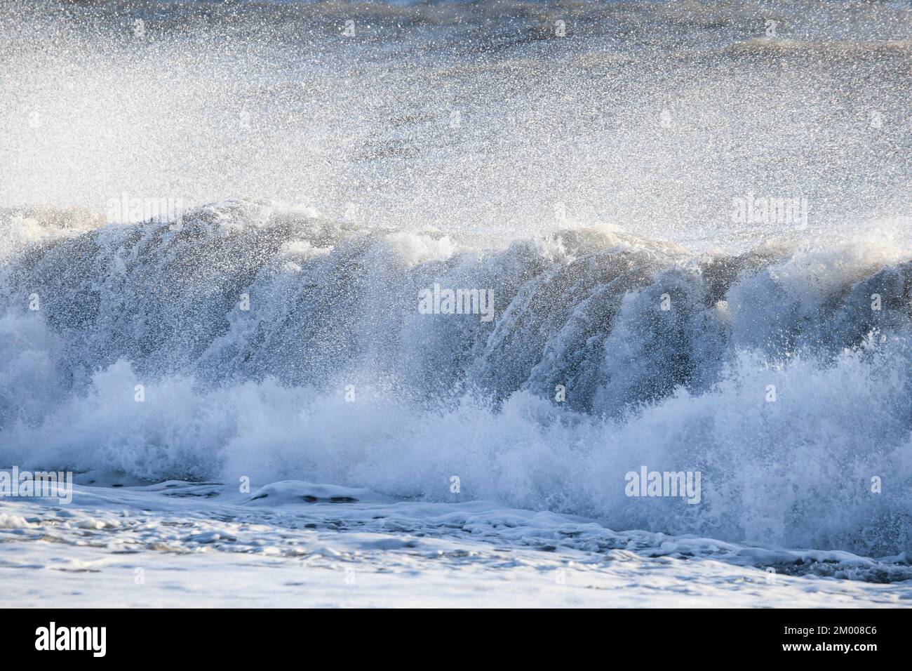 Large wave breaks during winter storm on Kachemak Bay beach, near Home ...