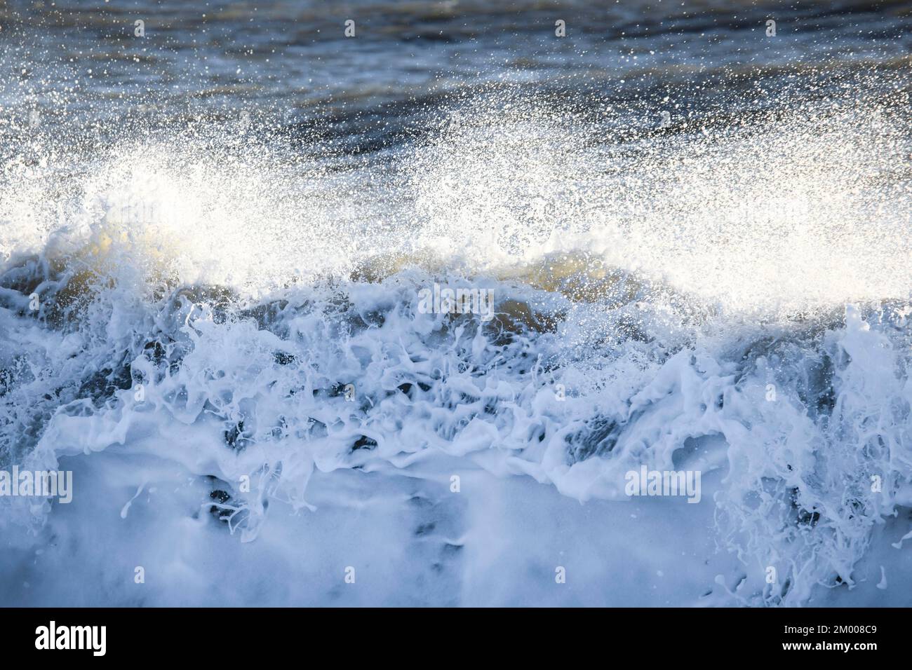 Large wave breaks during winter storm on Kachemak Bay beach, near Home ...